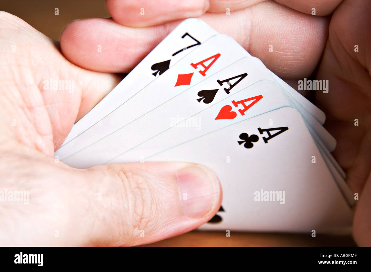Stock photo of a winning hand of cards that features four aces with a ...