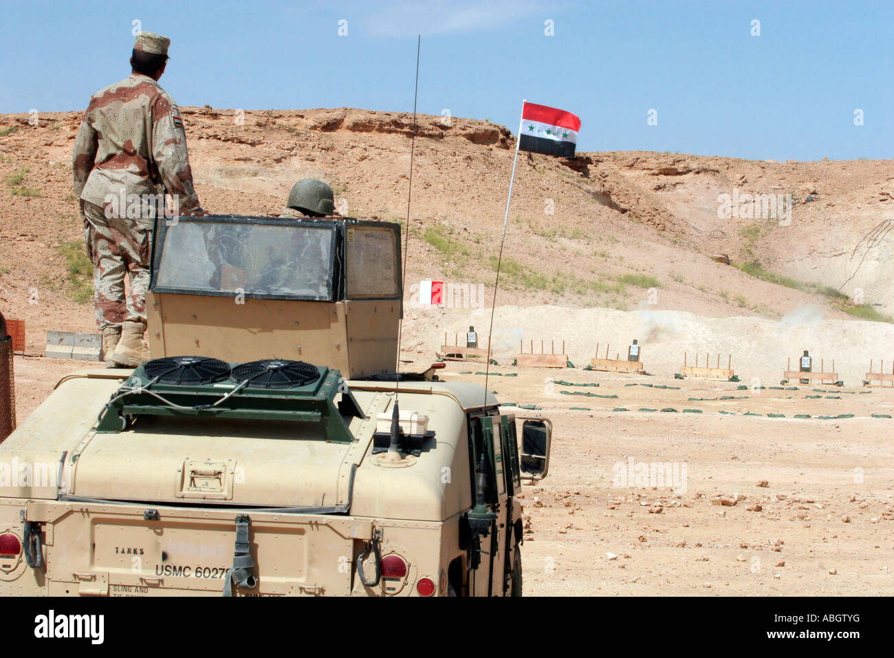 An instructor watches as an Iraqi army soldier in the School of ...