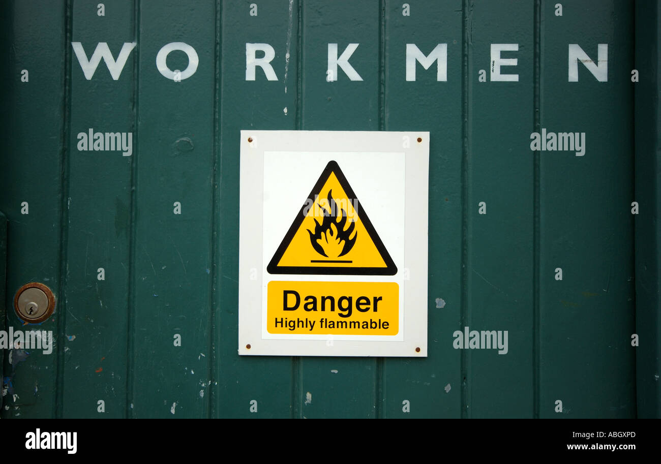 Workman and danger sign Stock Photo - Alamy