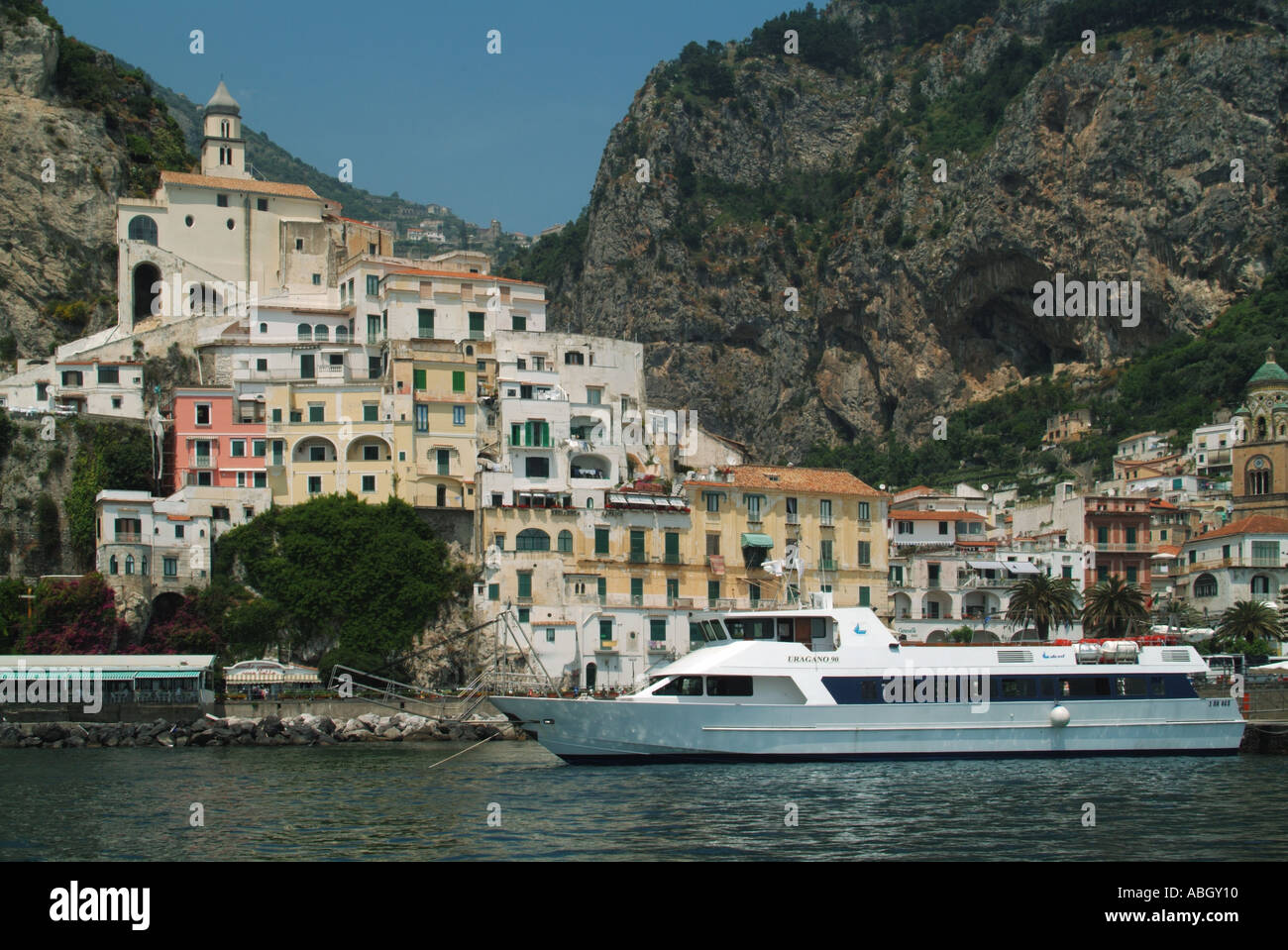 Amalfi town waterfront & cliff face landscape architecture of crowded ...