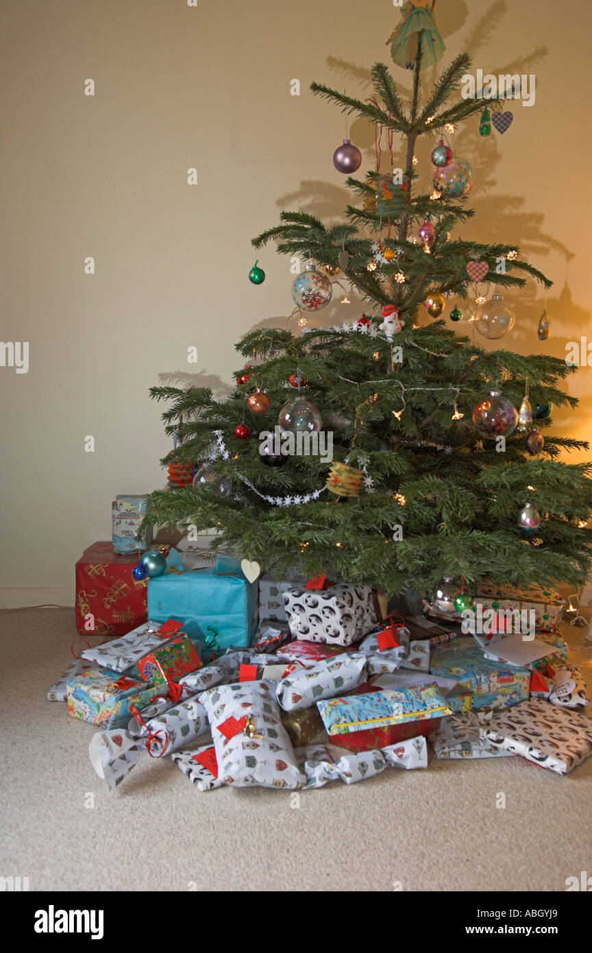 Christmas tree with lights and presents Stock Photo - Alamy
