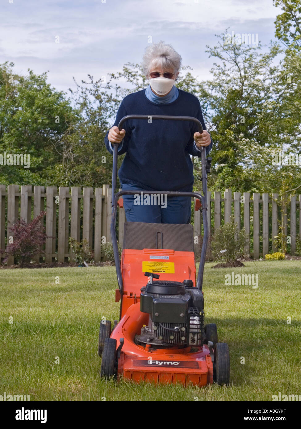 Mature Woman Mowing The Lawn Stock Photos & Mature Woman Mowing The ...