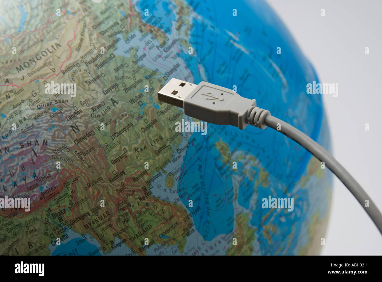 usb connector aimed at globe and China Stock Photo - Alamy