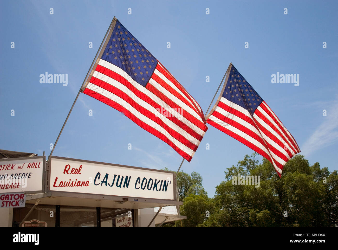 American flags flying from a Cajun junk food vendor's stand Stock Photo ...