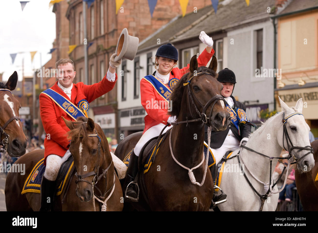 Annan Riding of the Marches Cornet and Cornets Lass on horses waving to ...