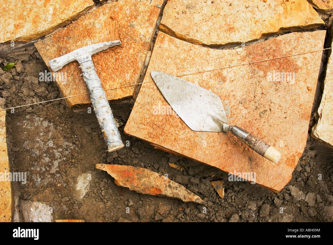 Stone mason tools resting on slabs of limestone Stock Photo - Alamy