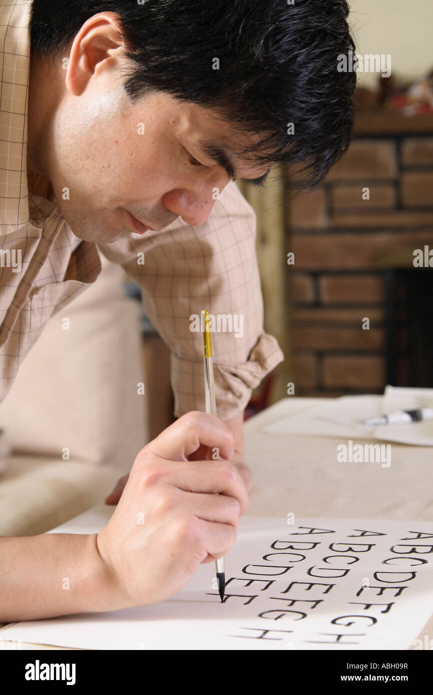 asian man writing chinese calligraphy Stock Photo - Alamy