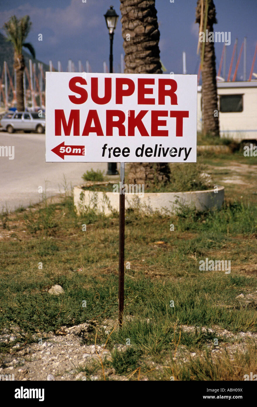 SUPERMARKET SIGN BOARD ON THE GROUND POROS ISLAND GREECE Stock Photo ...