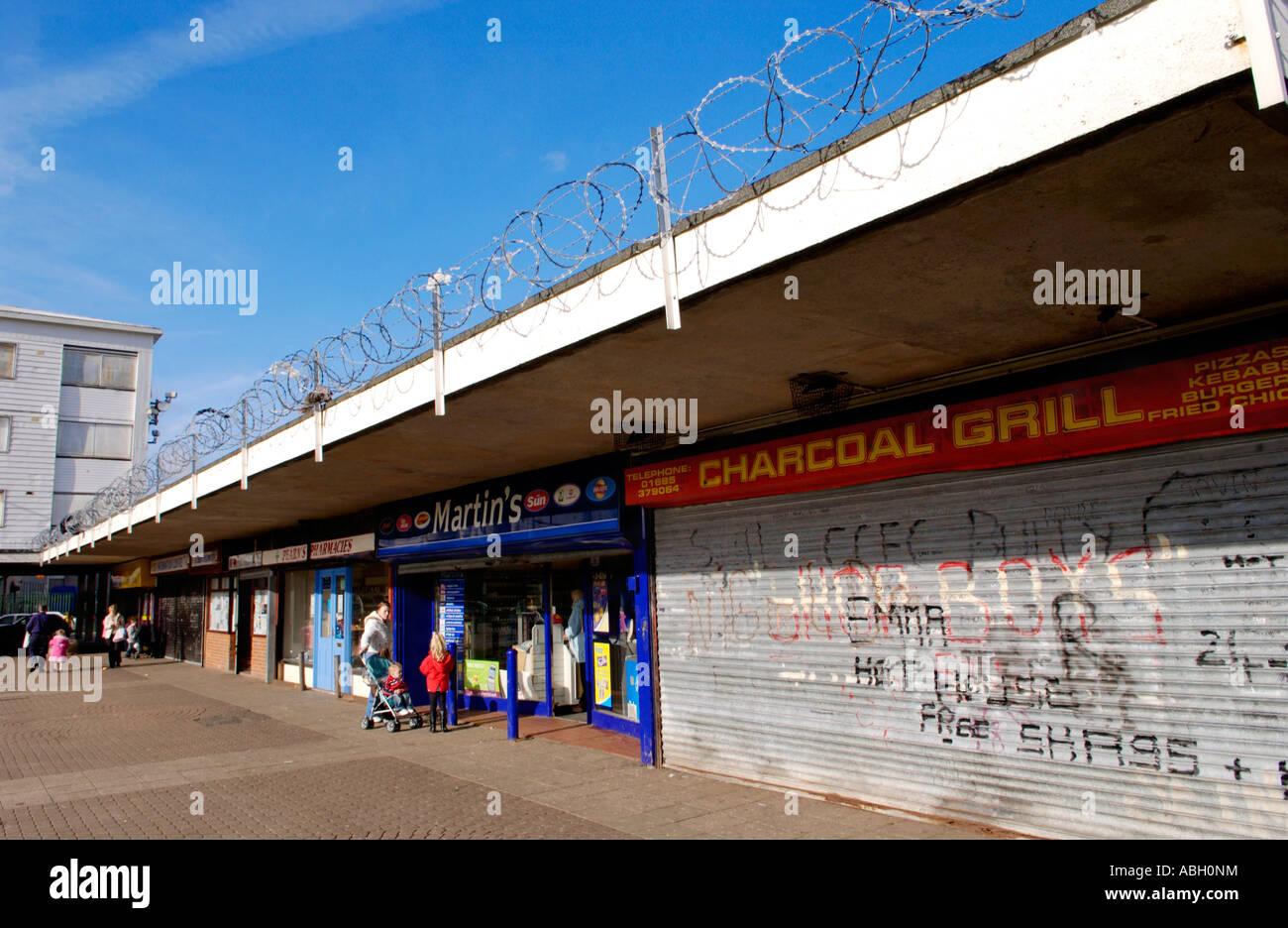 Run down shopping centre with razor wire on Gurnos Estate Merthyr ...