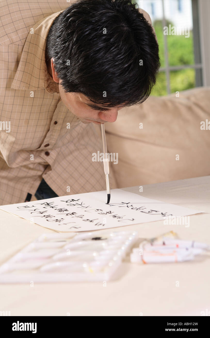 asian man writing chinese calligraphy Stock Photo - Alamy