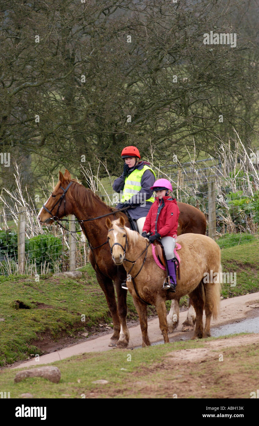 Pony trekkers riding down country lane on a Black Mountains riding loop ...