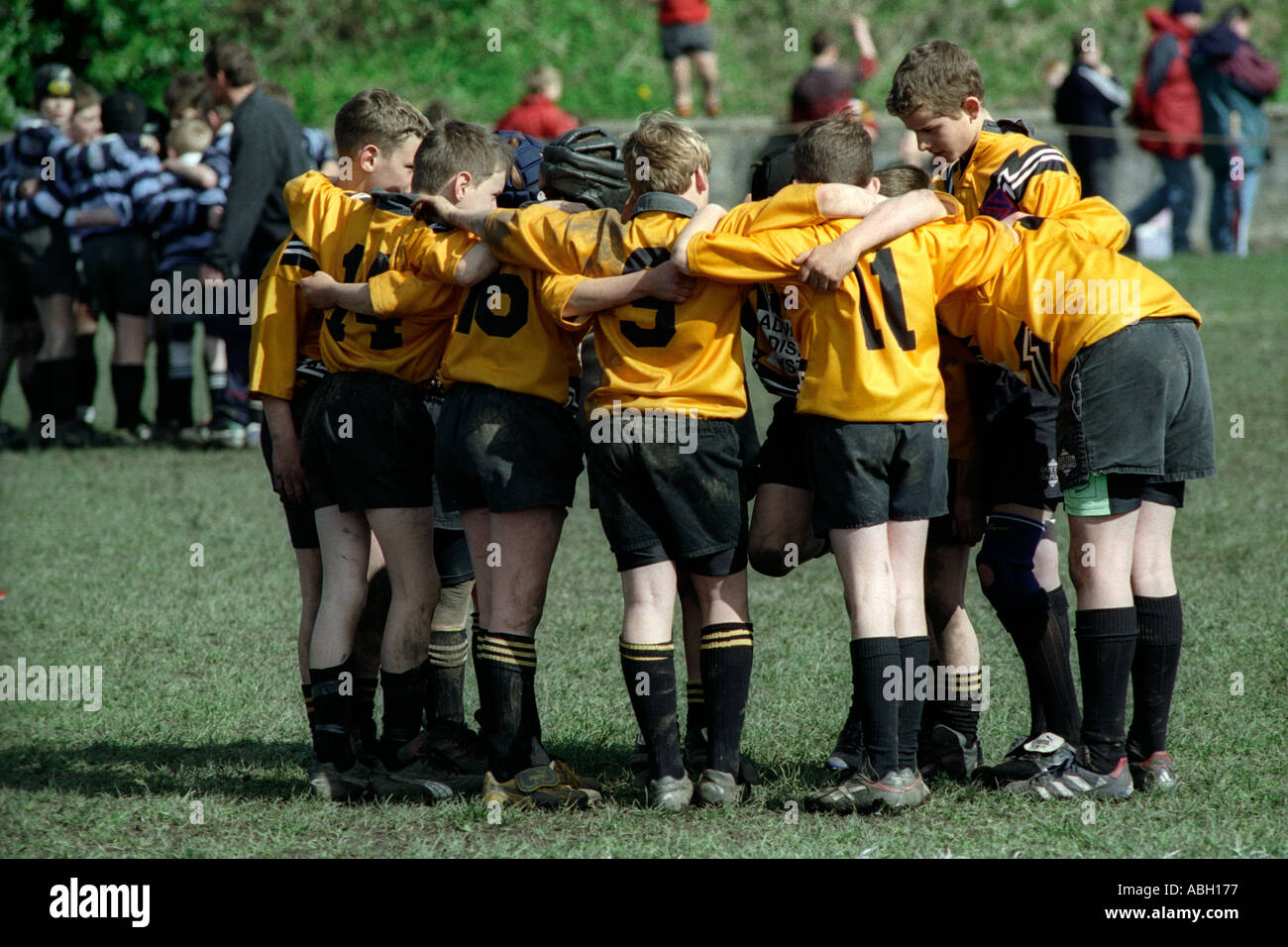 Players in huddle bonding at a mini rugby game in Ebbw Vale South Wales ...