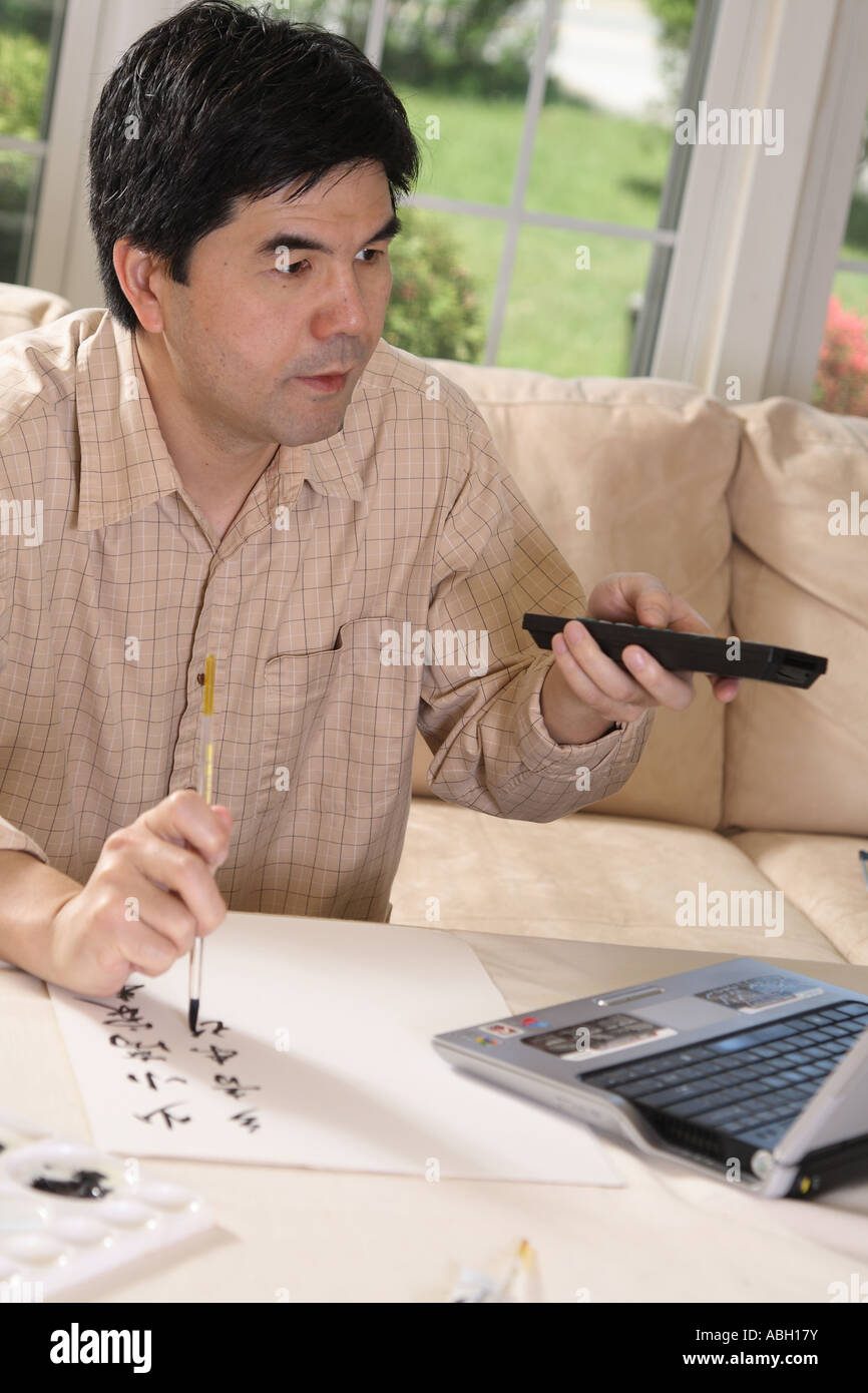 asian man writing chinese calligraphy Stock Photo - Alamy