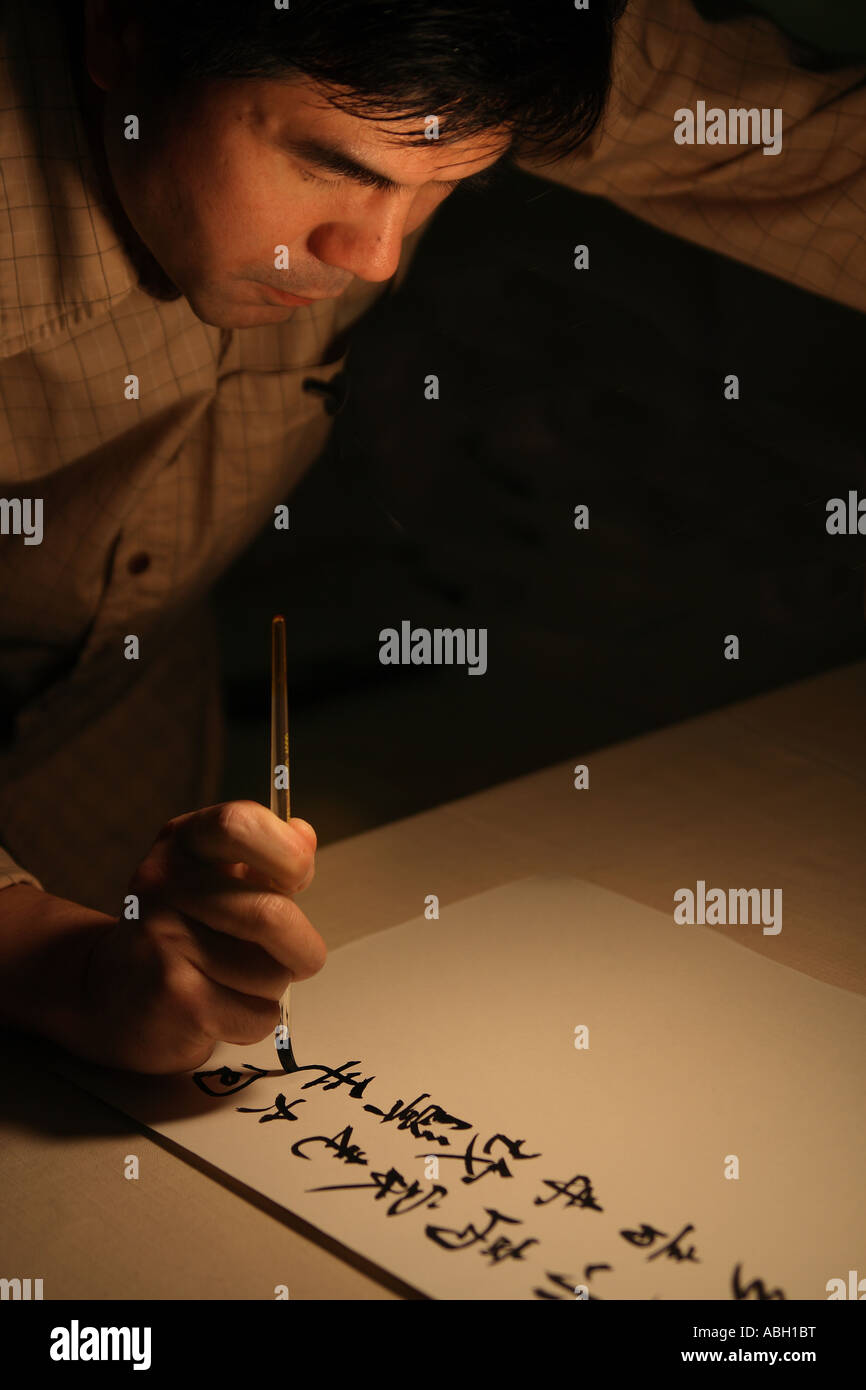 asian man writing chinese calligraphy Stock Photo - Alamy