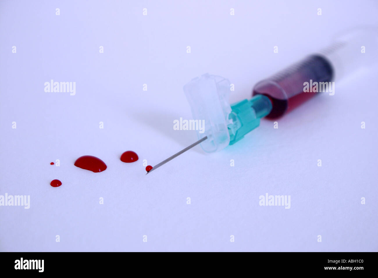 Needle and syringe containing human blood Stock Photo - Alamy