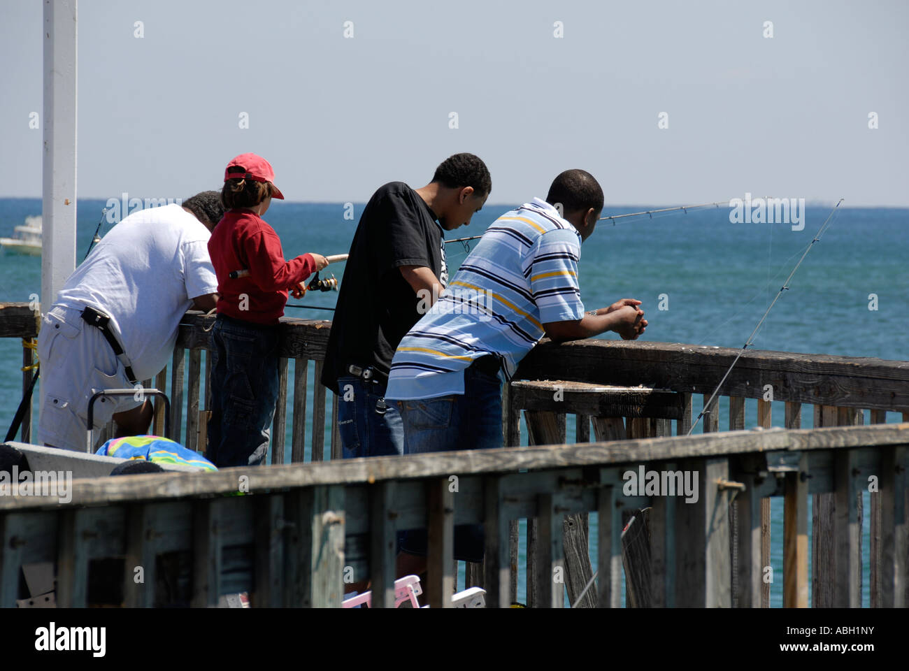 Men and boy fishing Stock Photo - Alamy