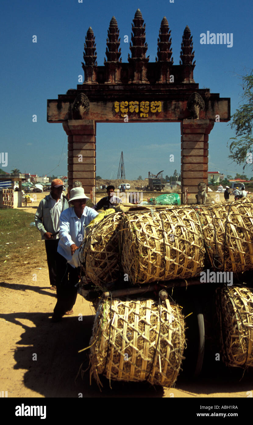 Bales of hay being transported across Cambodia to Vietnam border ...