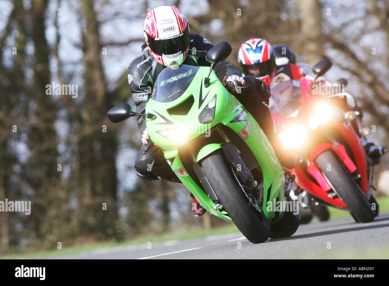 two motorbikes taking a corner Stock Photo - Alamy