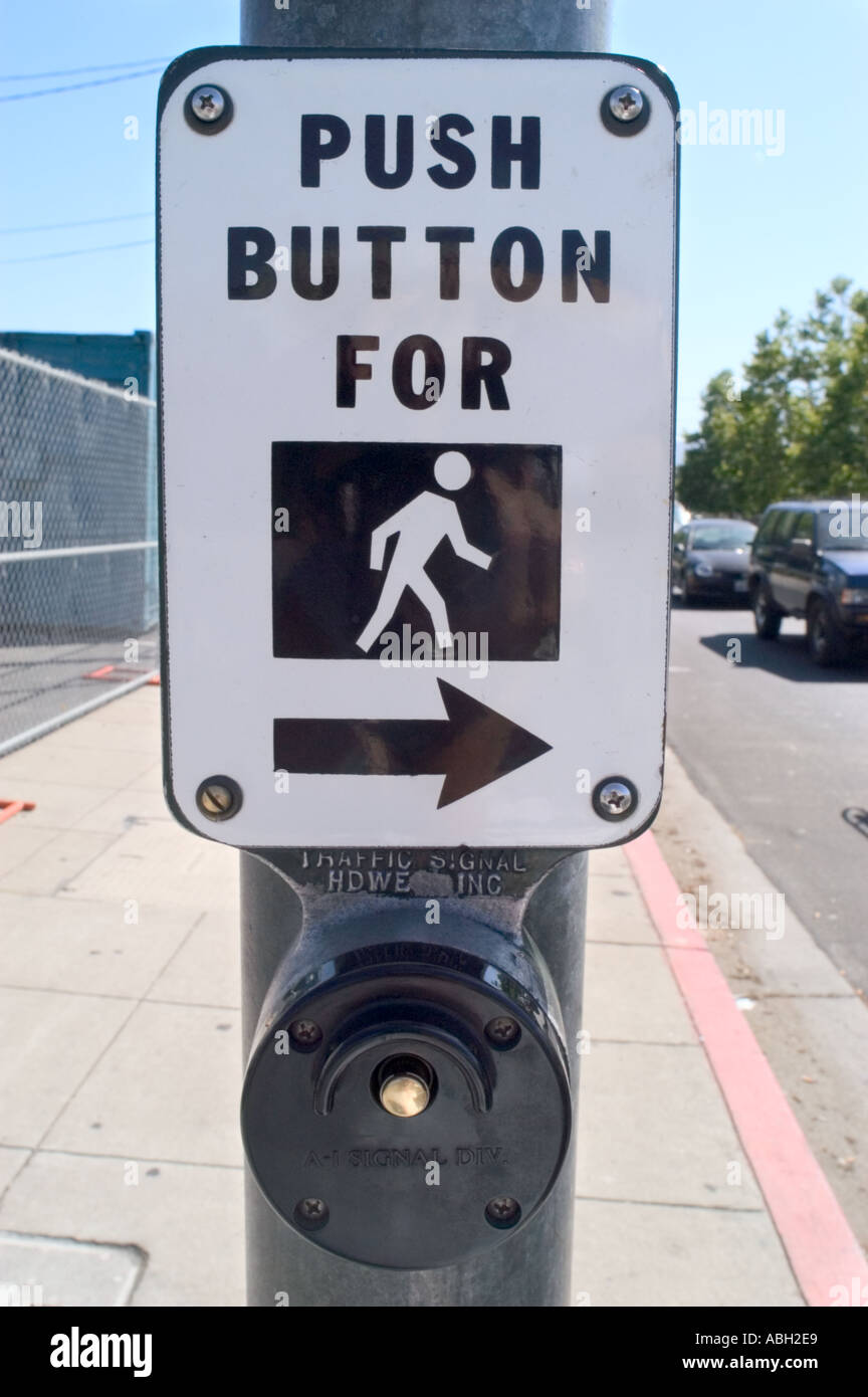 A close up photo of a push button for walk sign and the walk button at ...