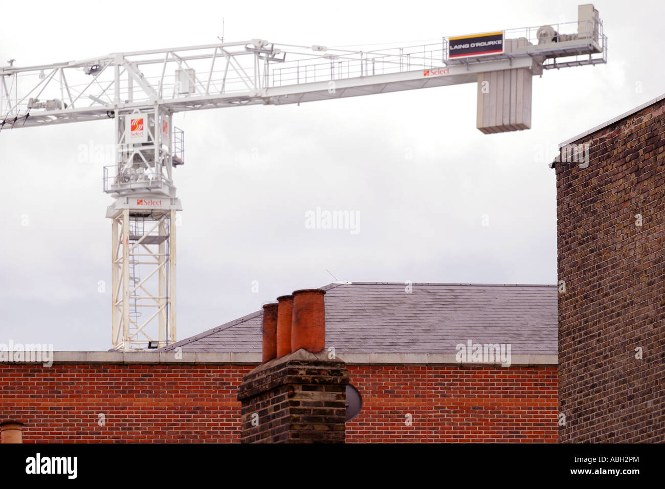 Crane and roof-tops, Stratford, London, UK, May 2007 Stock Photo - Alamy