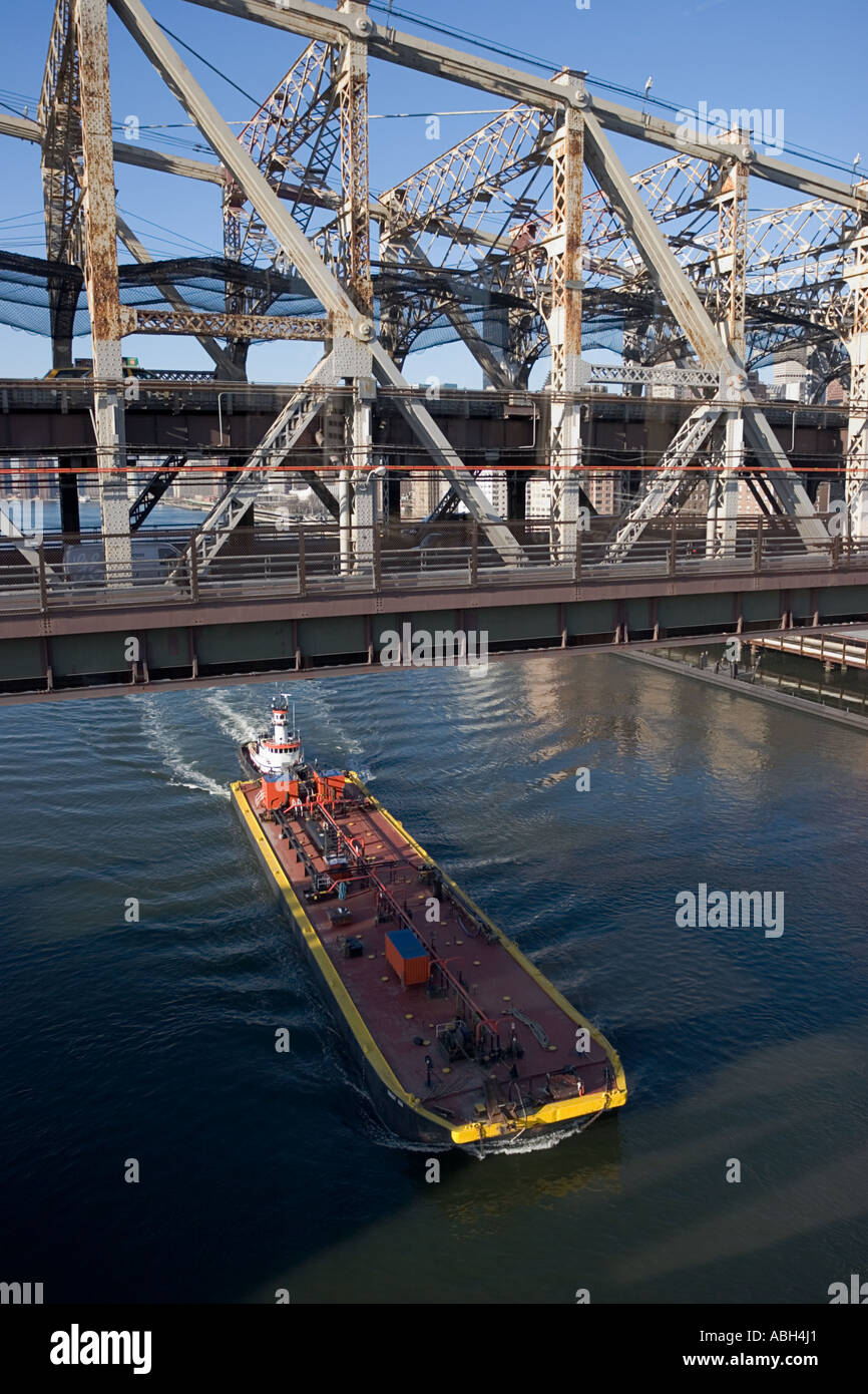 Ship sailing underneath bridge, New York, USA Stock Photo - Alamy
