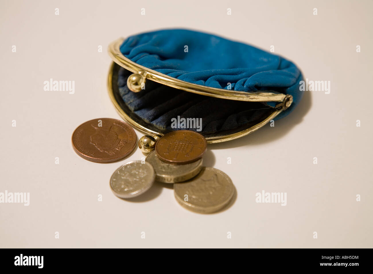 blue leather clam purse and money Stock Photo - Alamy