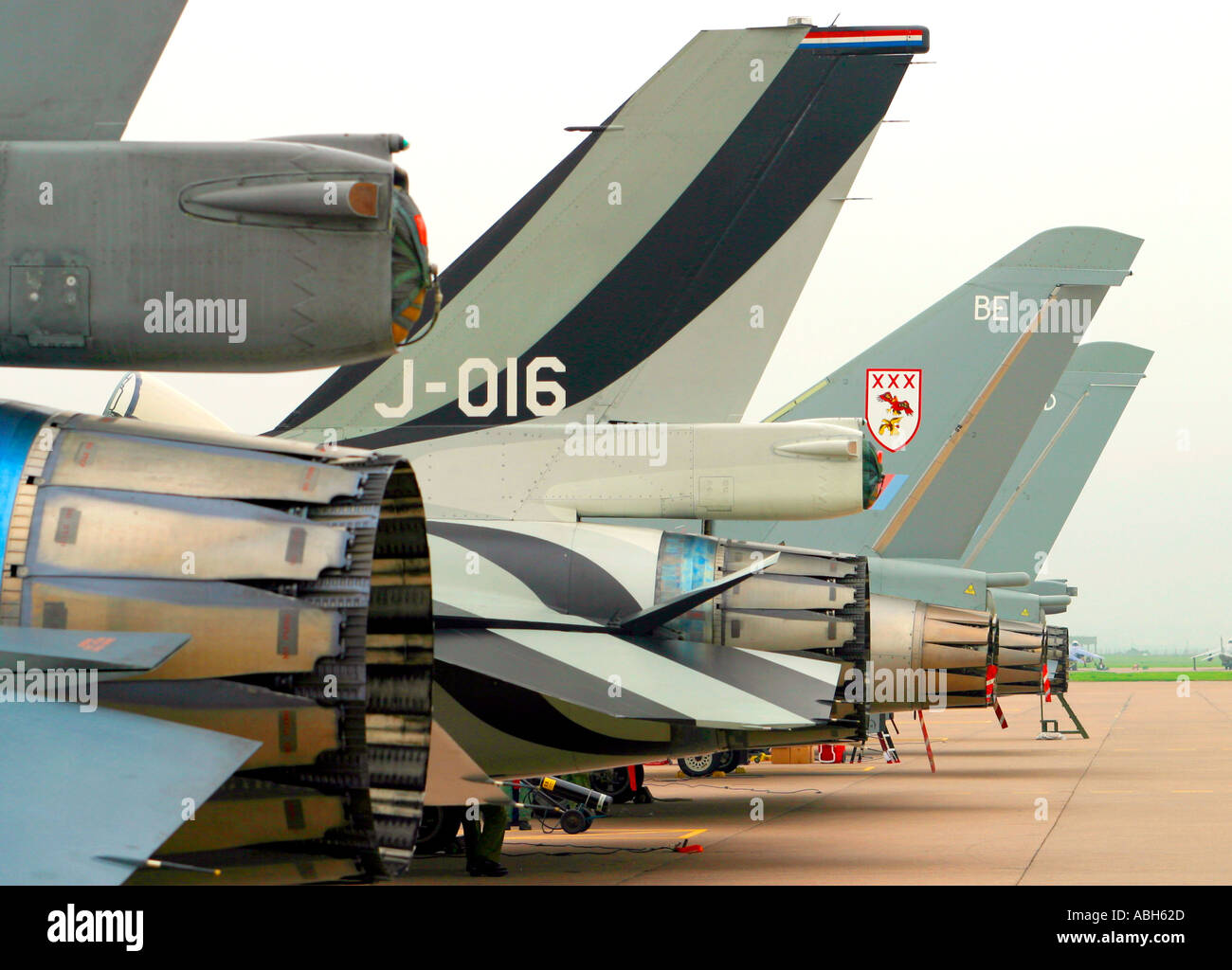 F16 fighter jet tails on static display line Stock Photo - Alamy