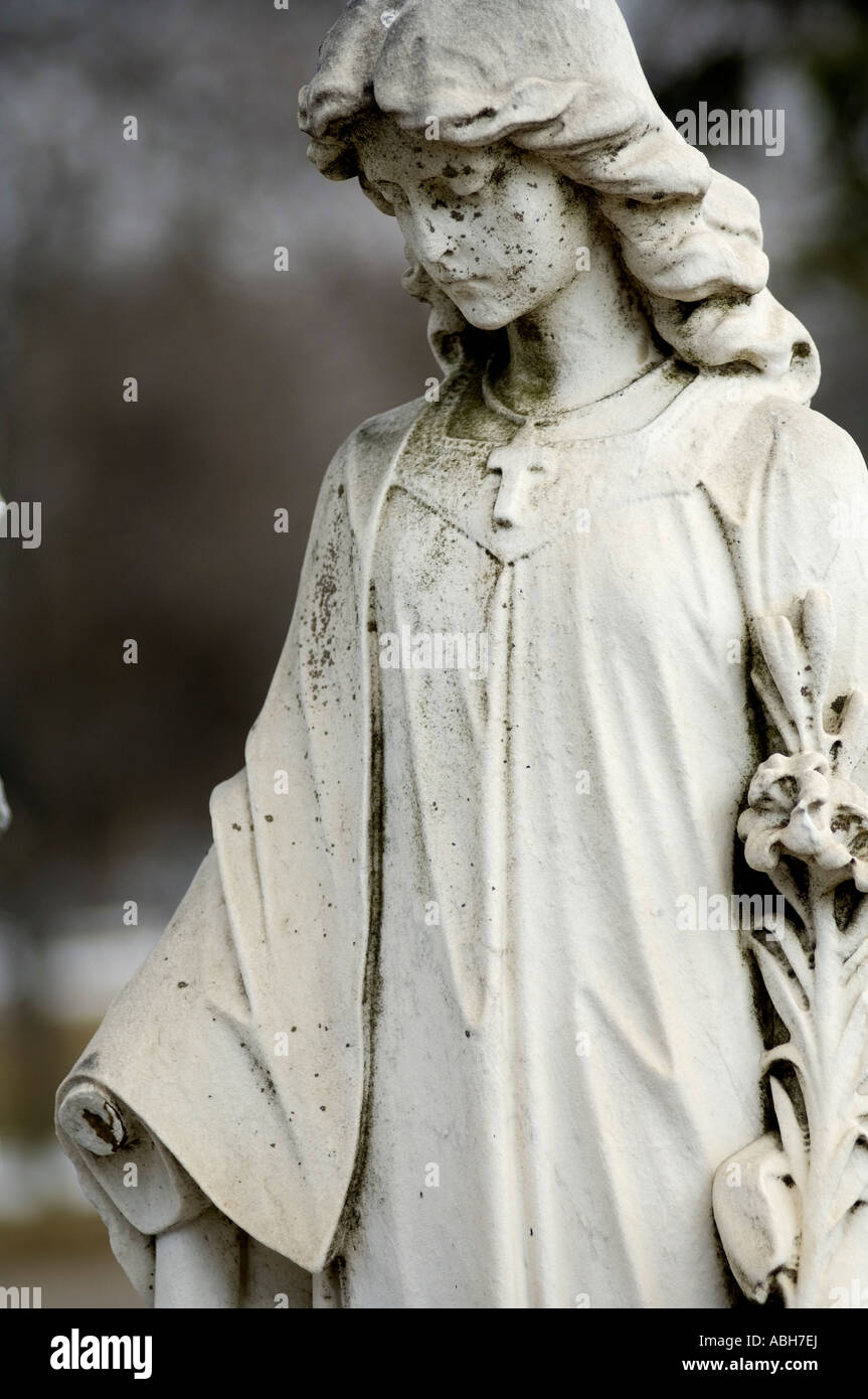 A statue missing a hand in a cemetery Stock Photo - Alamy