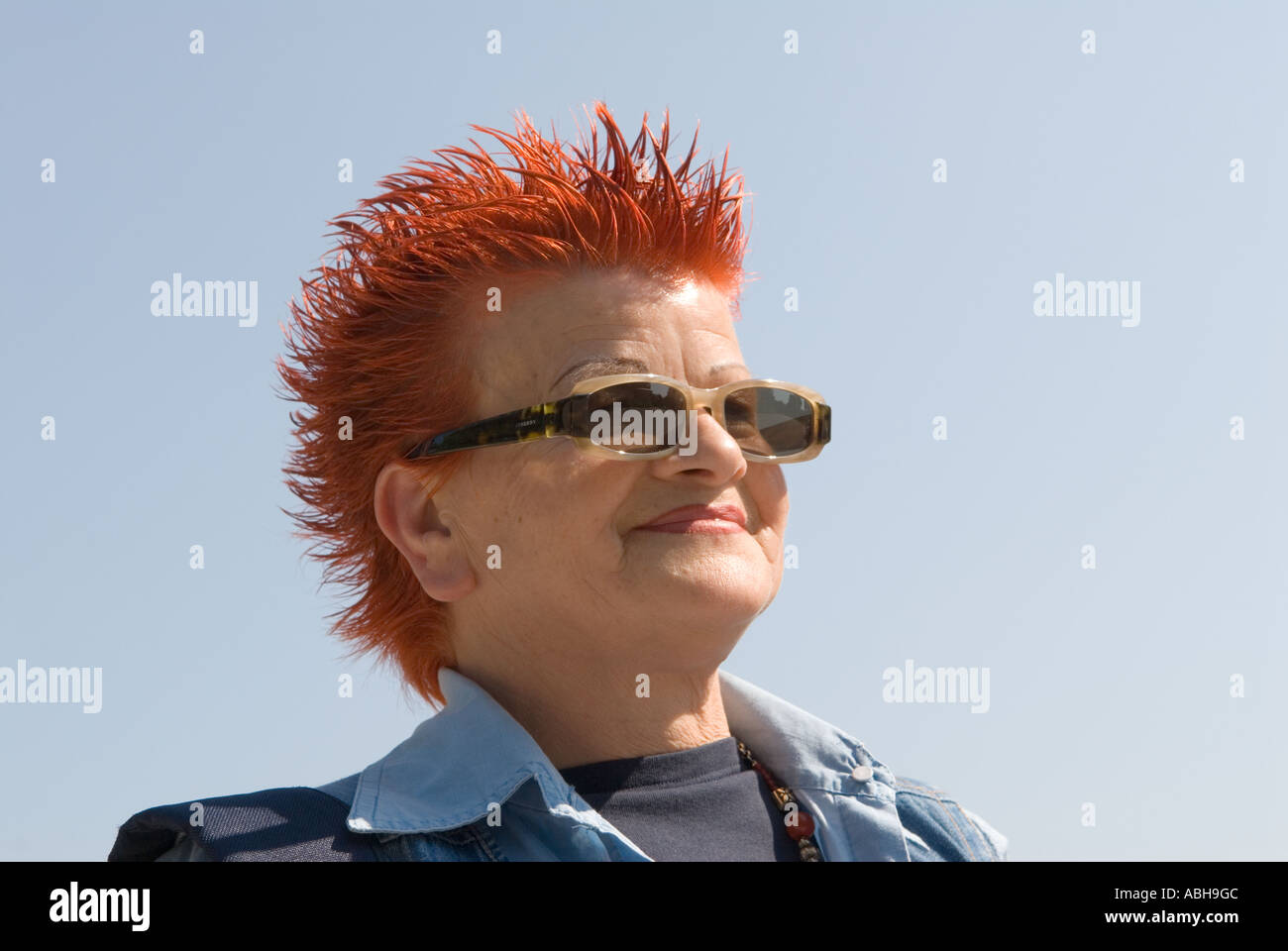 Older lady with a dyed red spikey punk hairstyle HOMER SYKES Stock ...