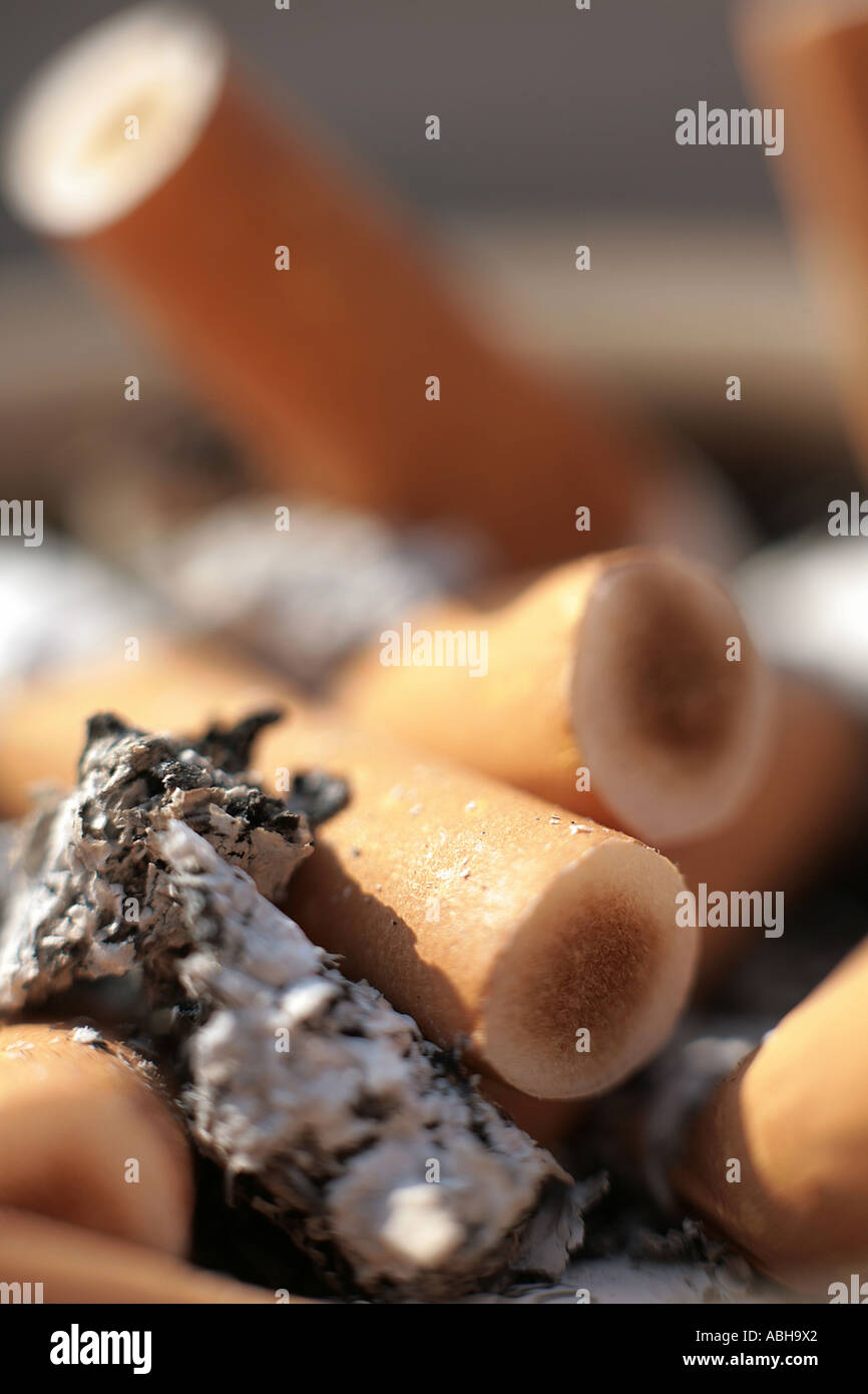 Cigarette stubs and ash Stock Photo - Alamy