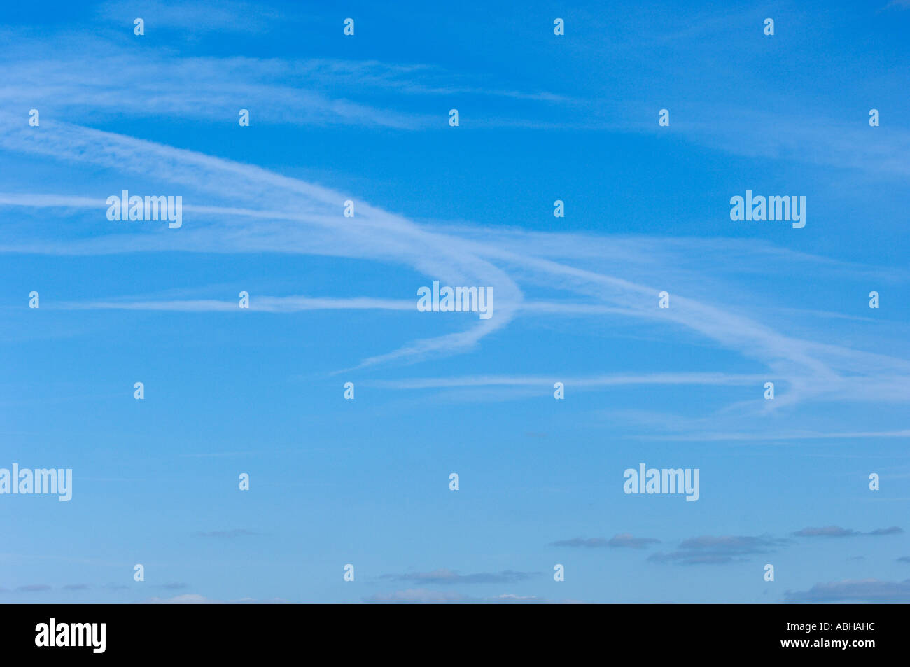 Bright sunny saturated blue sky with fluffy clouds Stock Photo - Alamy