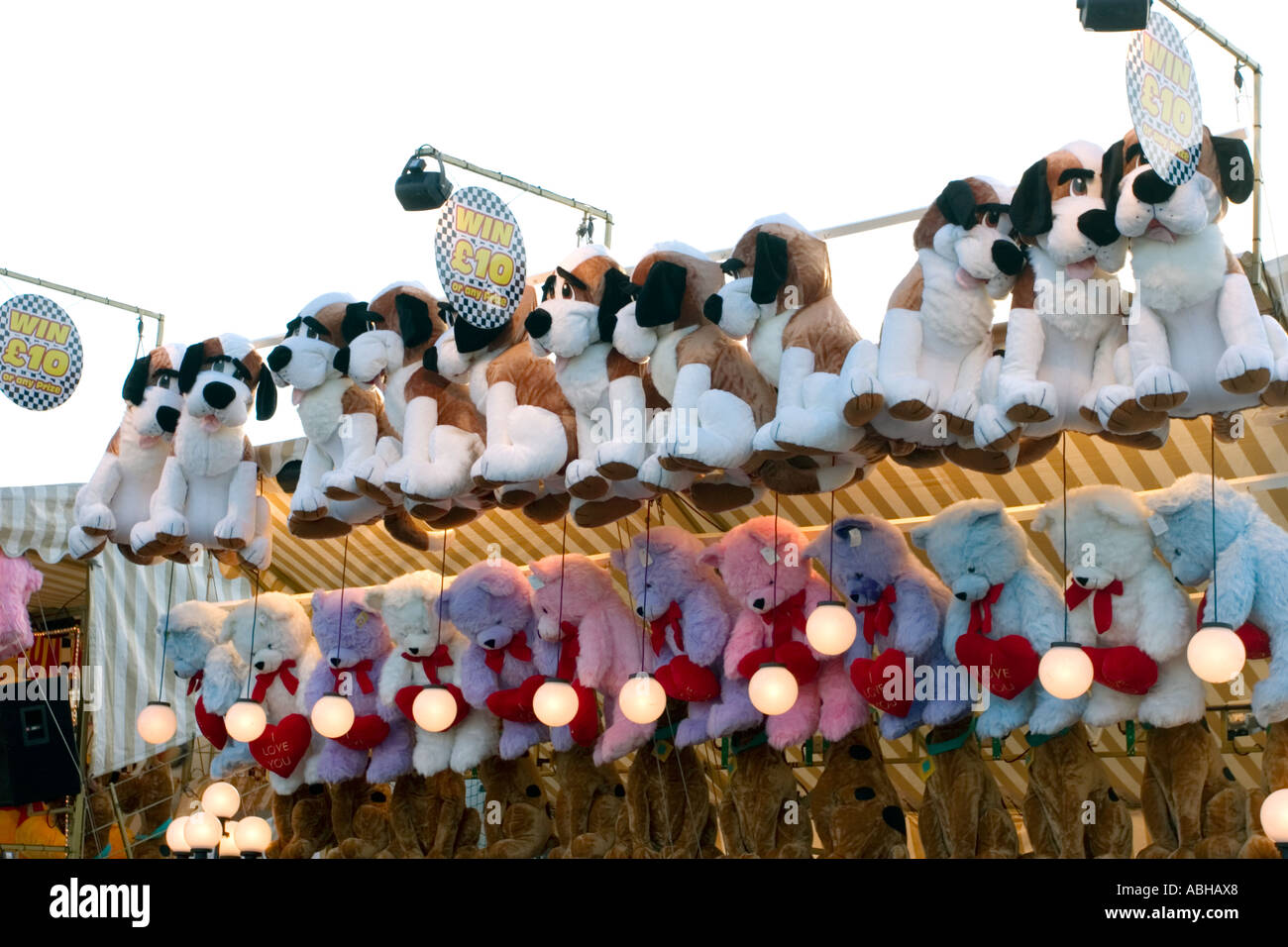 Cuddly soft toys on display at funfair game booth Stock Photo - Alamy
