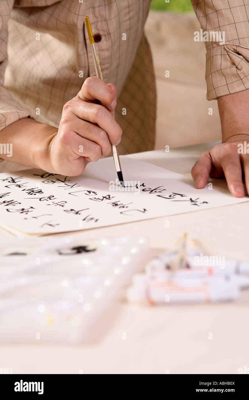 asian man writing chinese calligraphy Stock Photo - Alamy