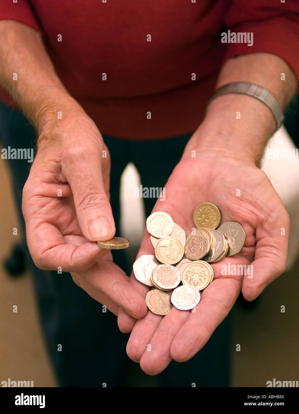 71 year old elderly man holding coins, London, UK Stock Photo - Alamy