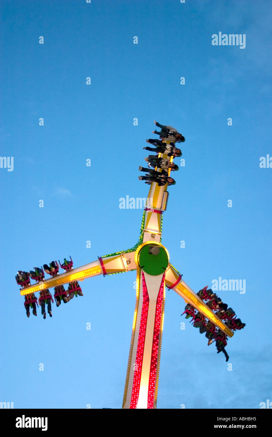 Spinning flying fairground scary ride high in the sky Stock Photo - Alamy