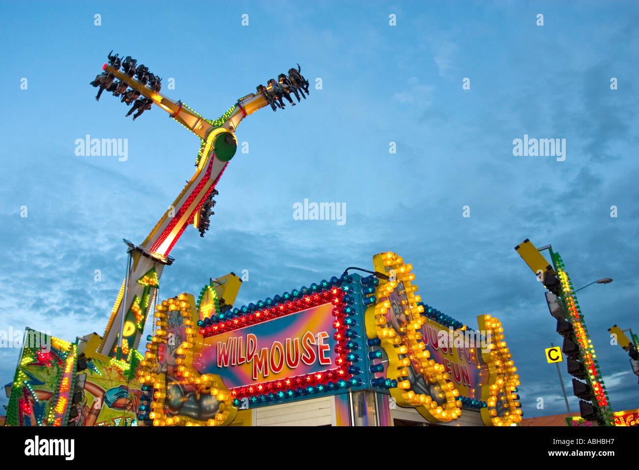 Spinning flying fairground scary ride high in the sky Stock Photo - Alamy