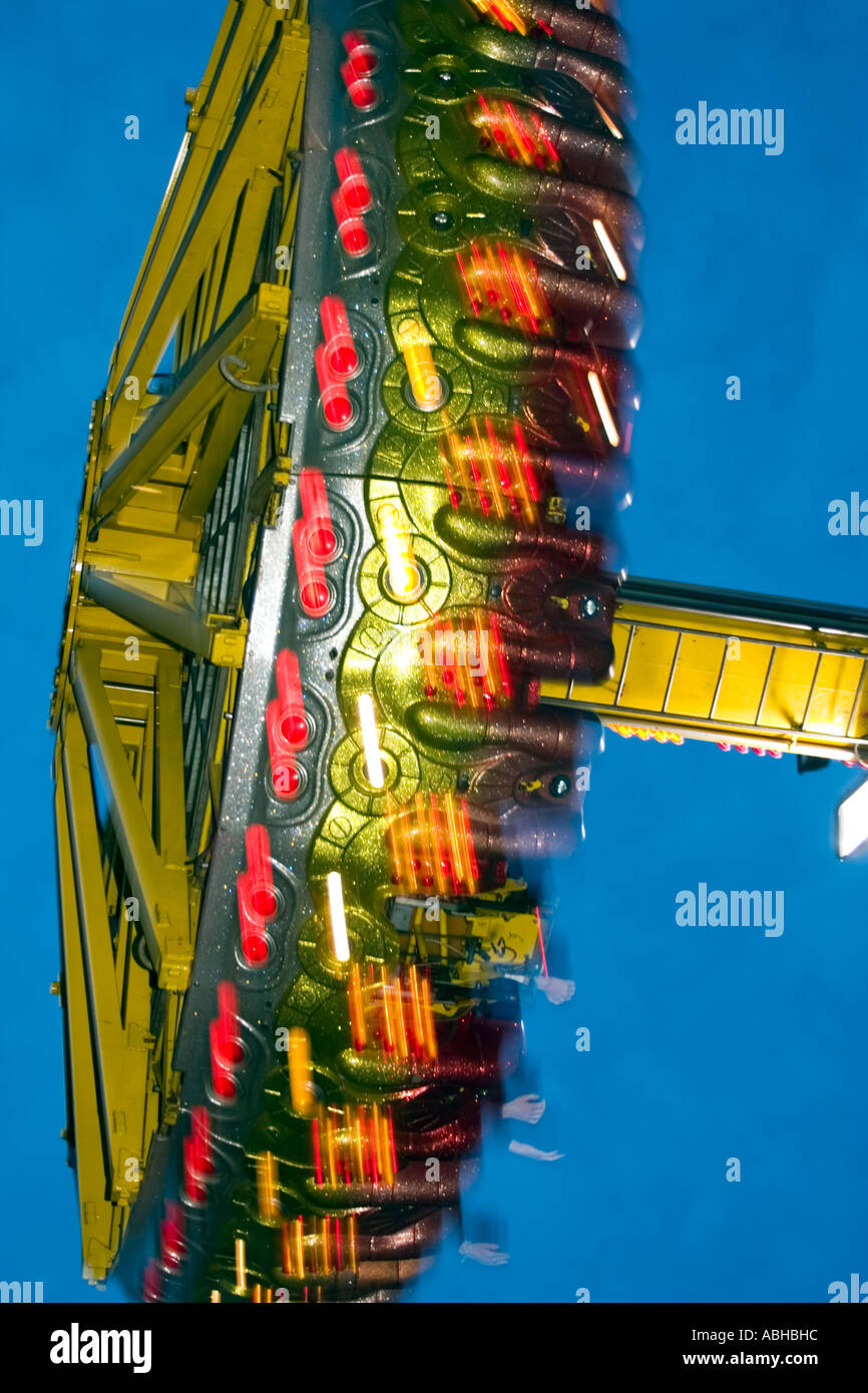 Rotating scary fairground ride high in the sky Stock Photo - Alamy