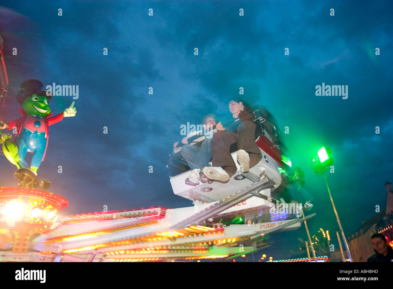 Rotating fun scary fairground ride Stock Photo - Alamy