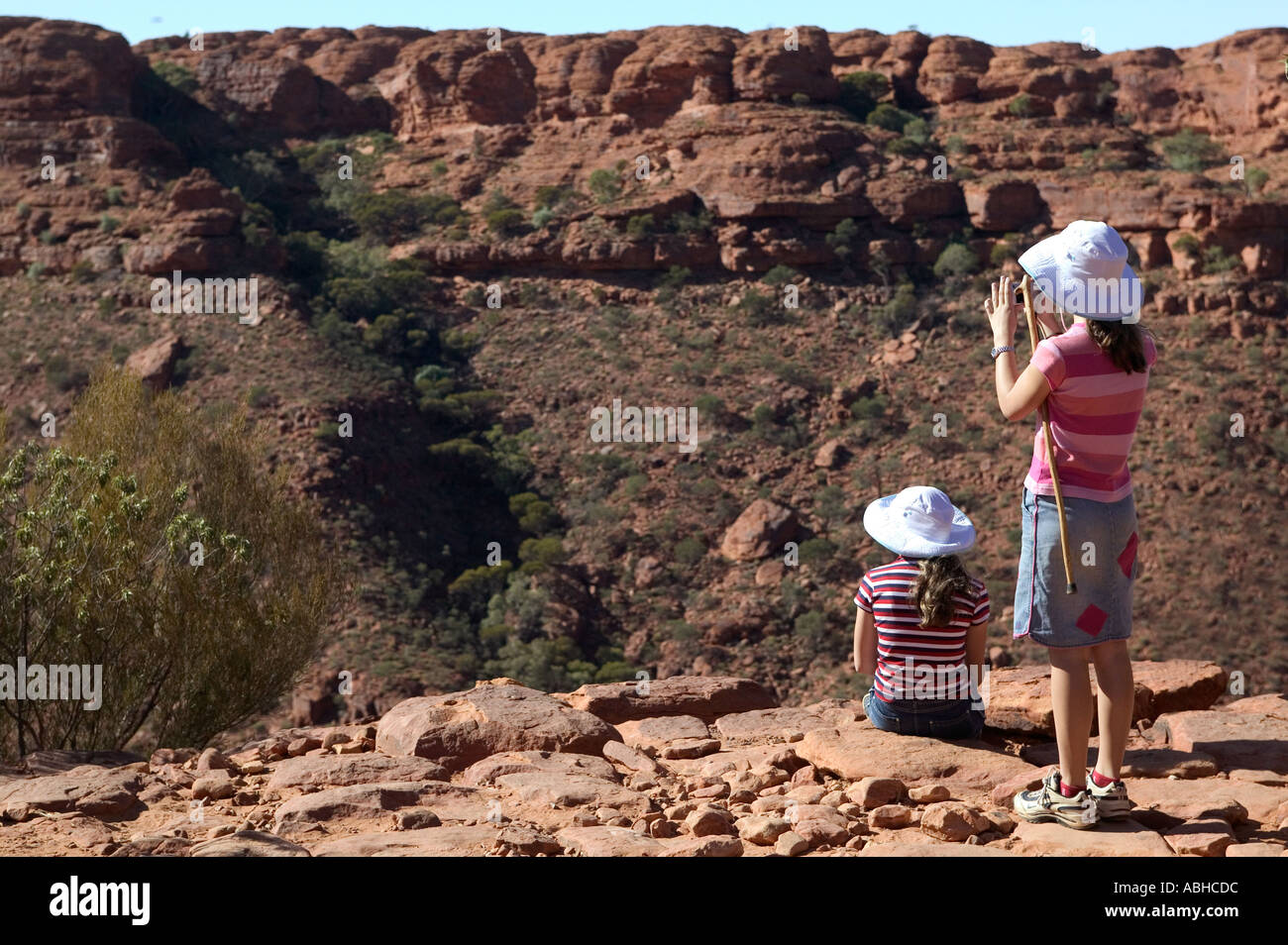 Young holidaymakers looking at Kings Canyon Northern Territory ... Young holidaymakers looking at Kings Canyon Northern Territory ...