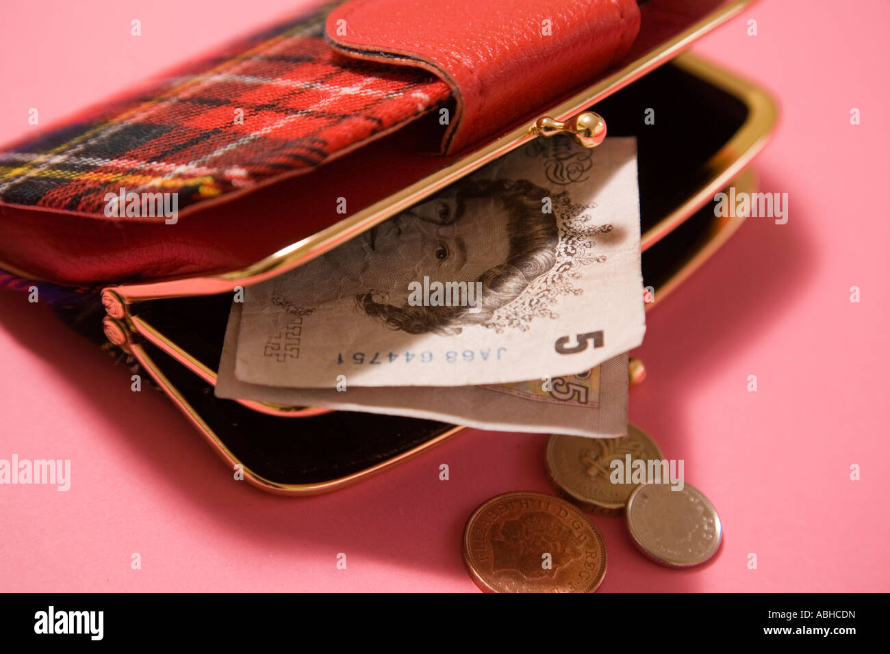 Five pound note and coins with purse Stock Photo - Alamy