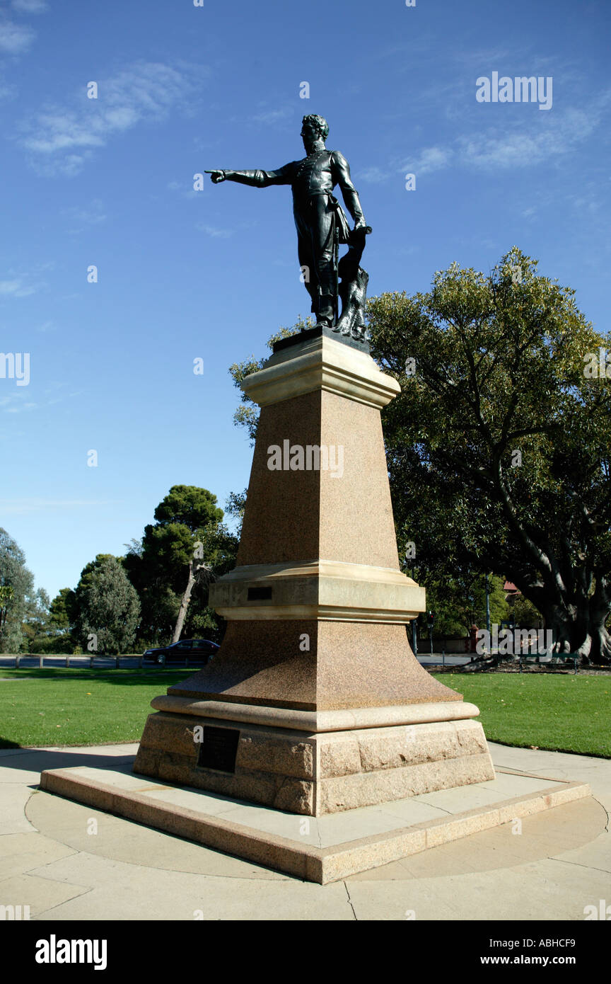 Holidaymaker looks at statue of Colonel WILLIAM LIGHT the founder of ...
