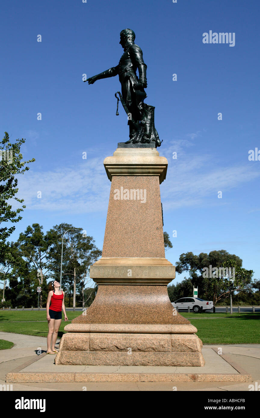 Holidaymaker looks at statue of Colonel WILLIAM LIGHT the founder of ...