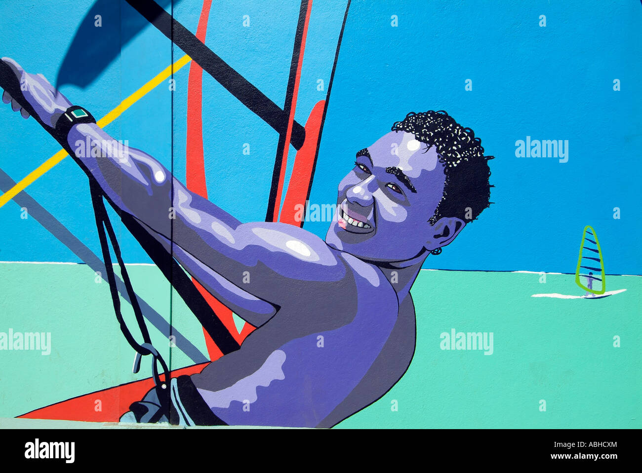 Painted wall with a black windsurfer in Bonaire Stock Photo - Alamy