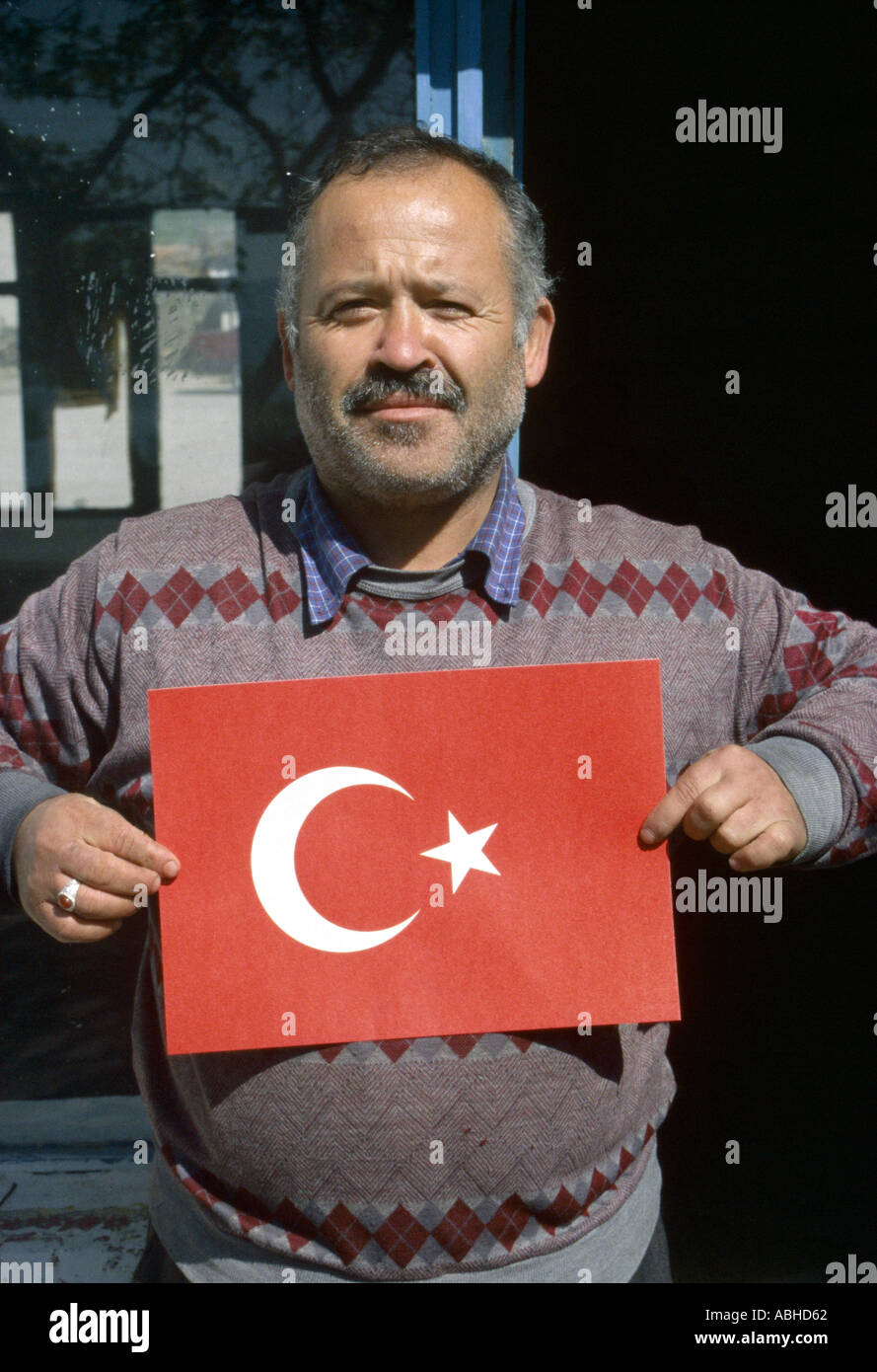 Turk holding a Turkish flag Stock Photo - Alamy