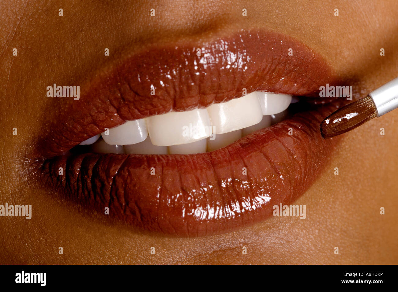Young woman applying lipstick, close-up Stock Photo - Alamy