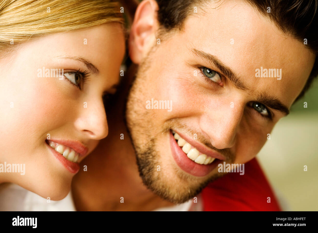 Portrait of a young smiling couple Stock Photo - Alamy