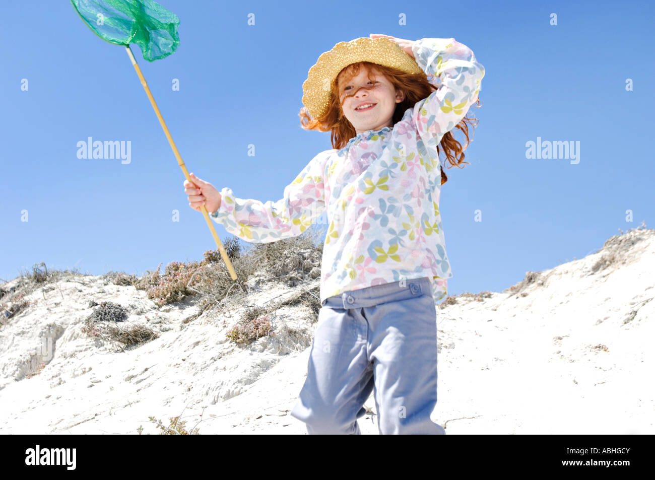 Children playing with the sand on a sand dune hi-res stock photography ...