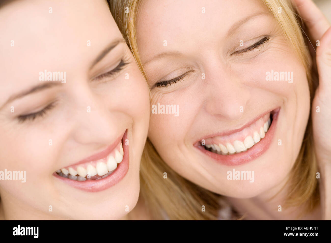 Portrait of two smiling women, indoors Stock Photo - Alamy