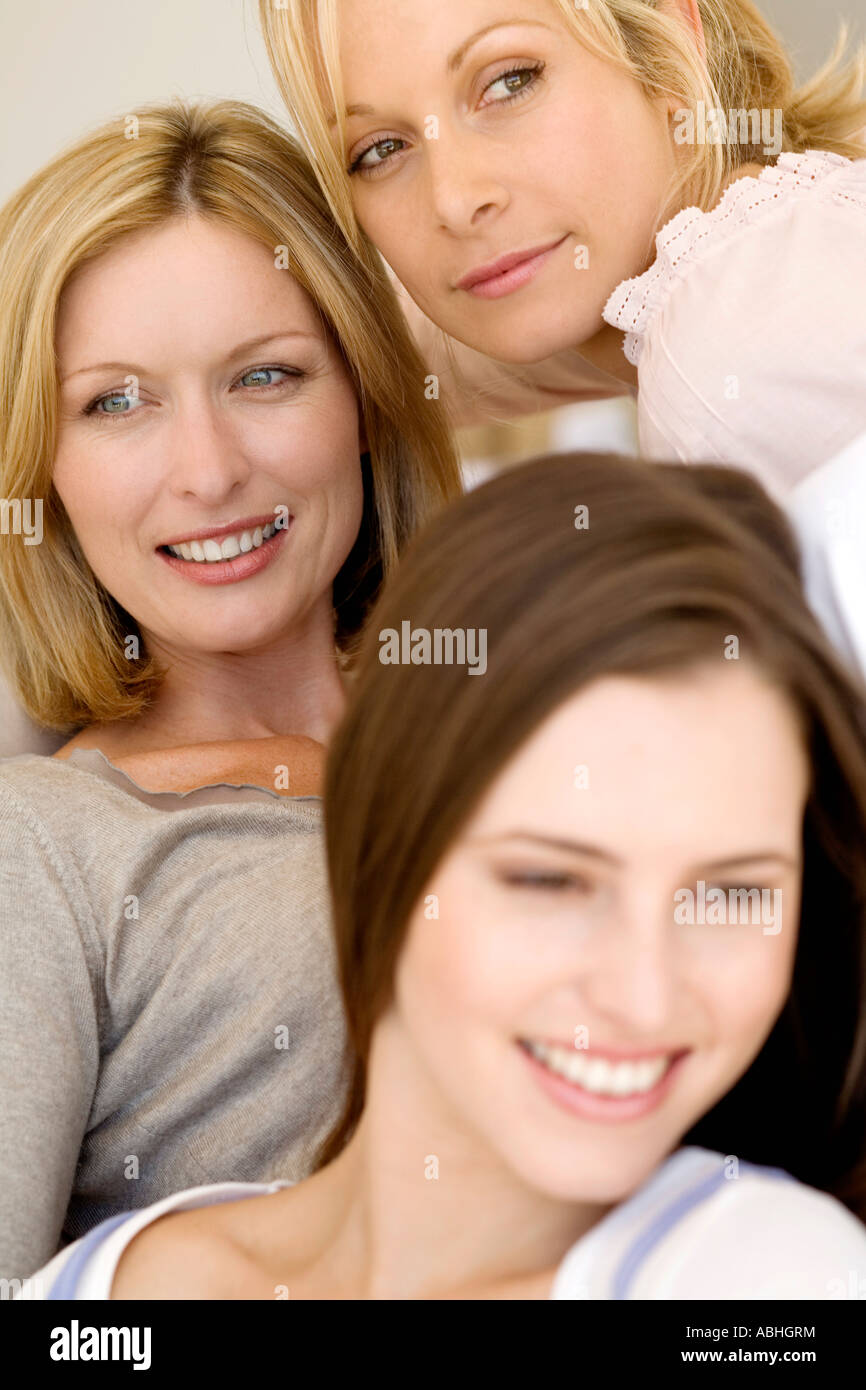 Three smiling women, indoors Stock Photo - Alamy