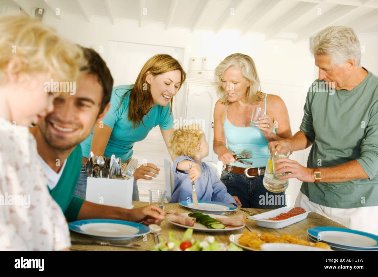 Family at home Stock Photo - Alamy